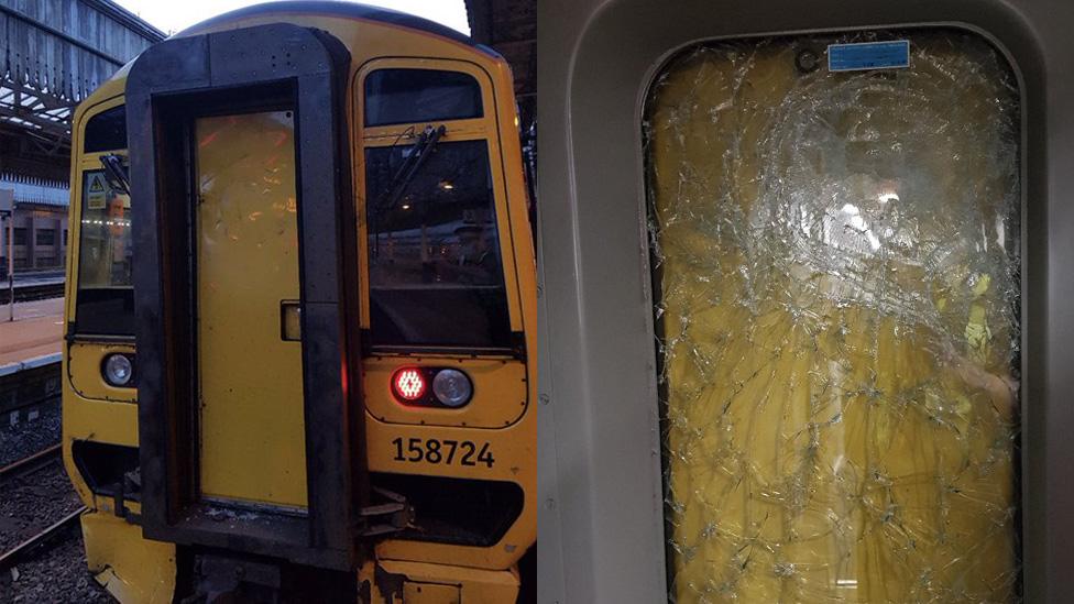 Train damaged by traffic cone thrown from bridge - BBC News