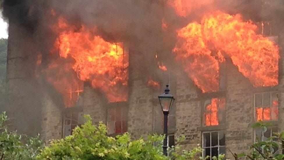 Teenager arson arrest after derelict mill fire in Oldham - BBC News