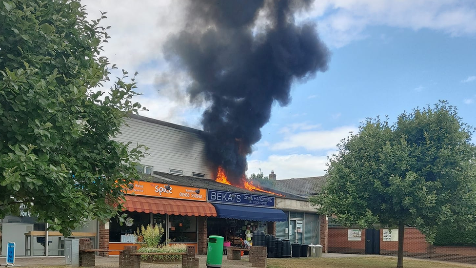 Long Stratton flat residents 'lose everything' in shops blaze - BBC News