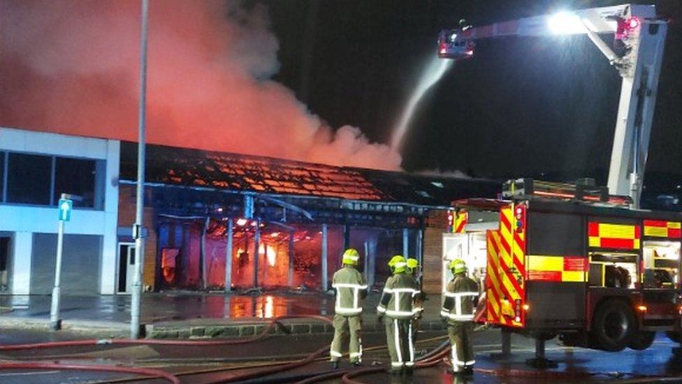 Dozens of firefighters tackle commercial blaze in Batley - BBC News