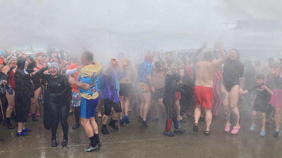 Dozens brave icy water for New Year's Day North Sea charity swims - BBC ...