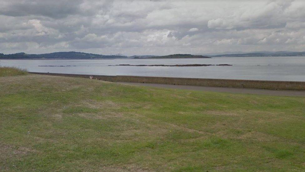 Two people and their dogs rescued from Granton rocks - BBC News
