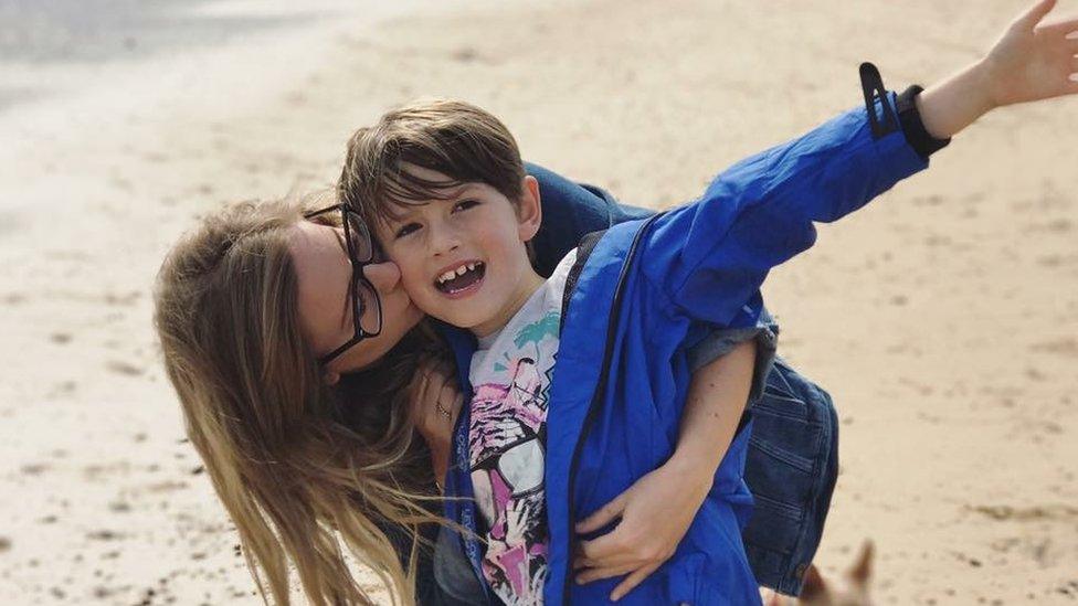 Colchester boy, 8, steers car to safety after mum has seizure - BBC News