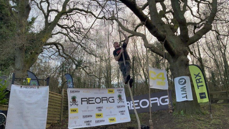Former commando completes 24-hour charity rope climb - BBC News