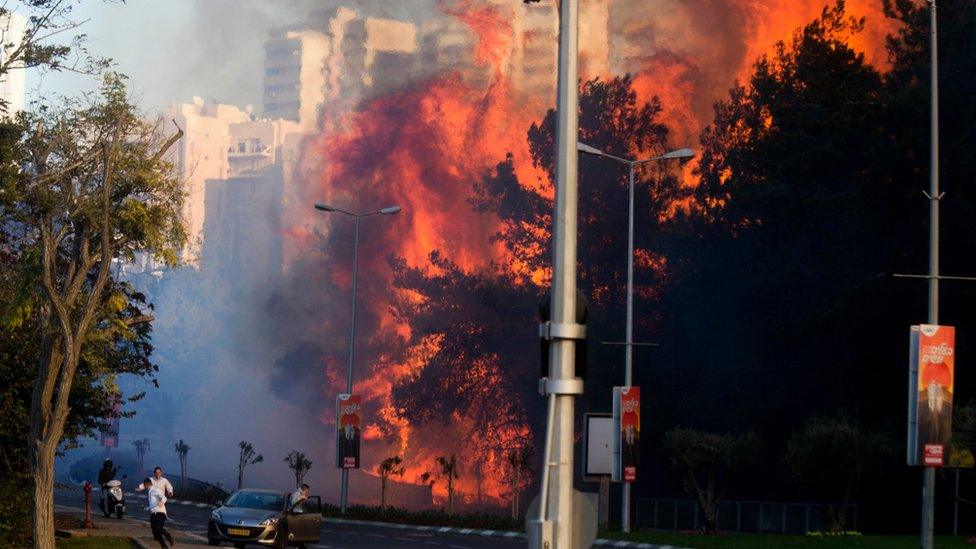 Israel fires: Tens of thousands flee as fires hit Haifa - BBC News