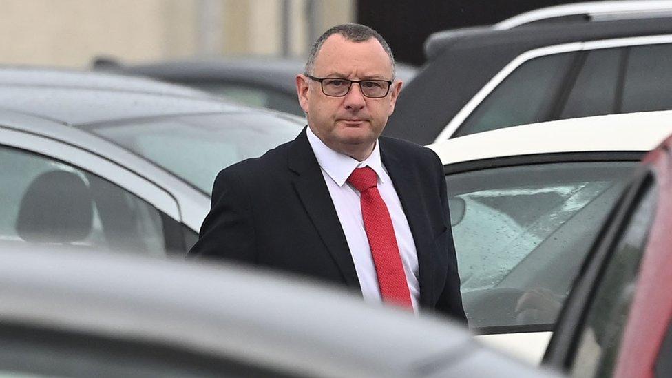 Ex PSNI officer who filmed woman undress sentenced - BBC News