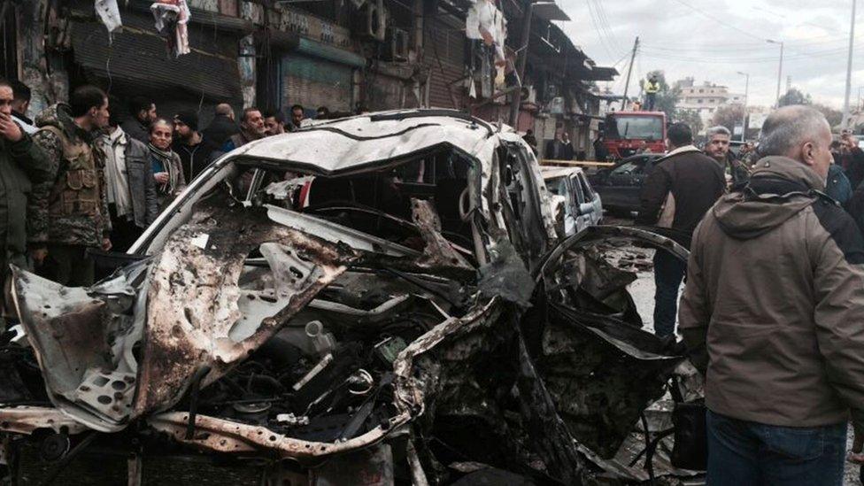 Syria conflict: Car bomb kills 11 in government-held town - BBC News