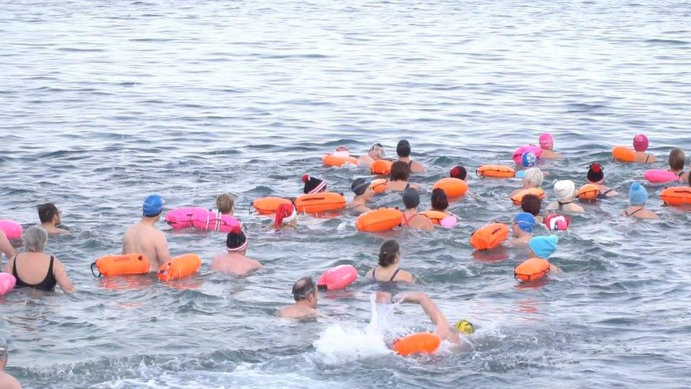 Donaghadee 'Chunky Dunkers' brave winter waves - BBC News