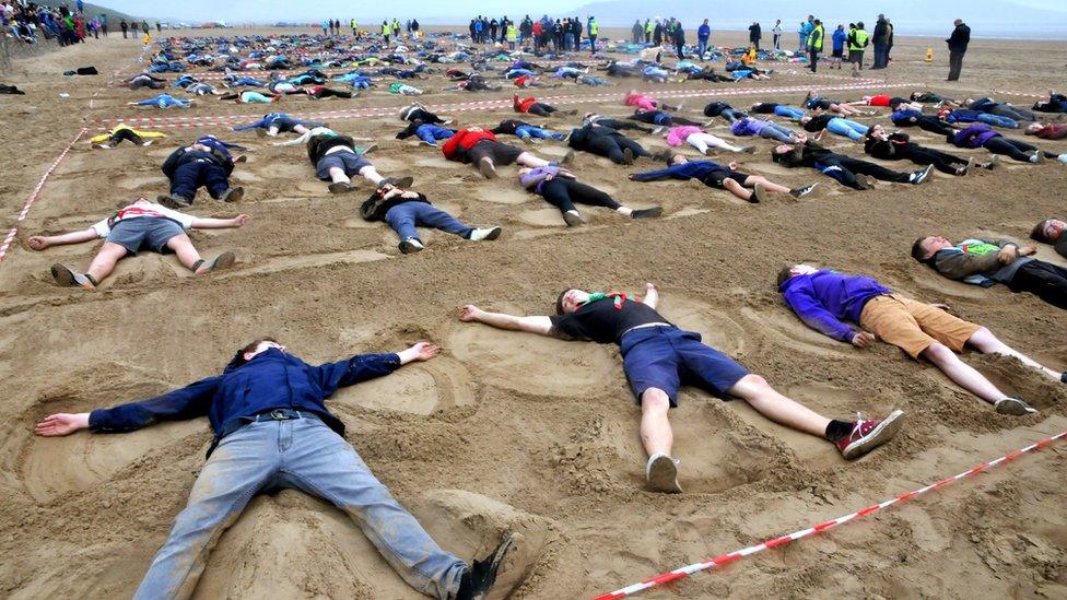 Sand angels world record bid held on Weston-super-Mare beach - BBC News
