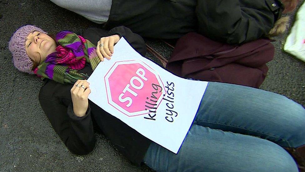 Cyclists stage 'die-in' protest in London for safer roads - BBC News