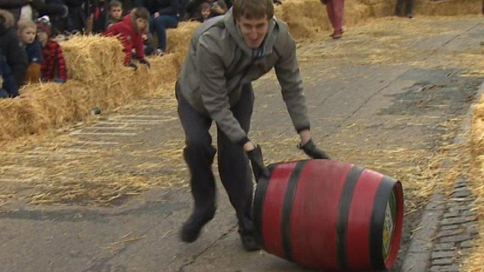 Entrants travel globe for Denbigh barrel-rolling race - BBC News