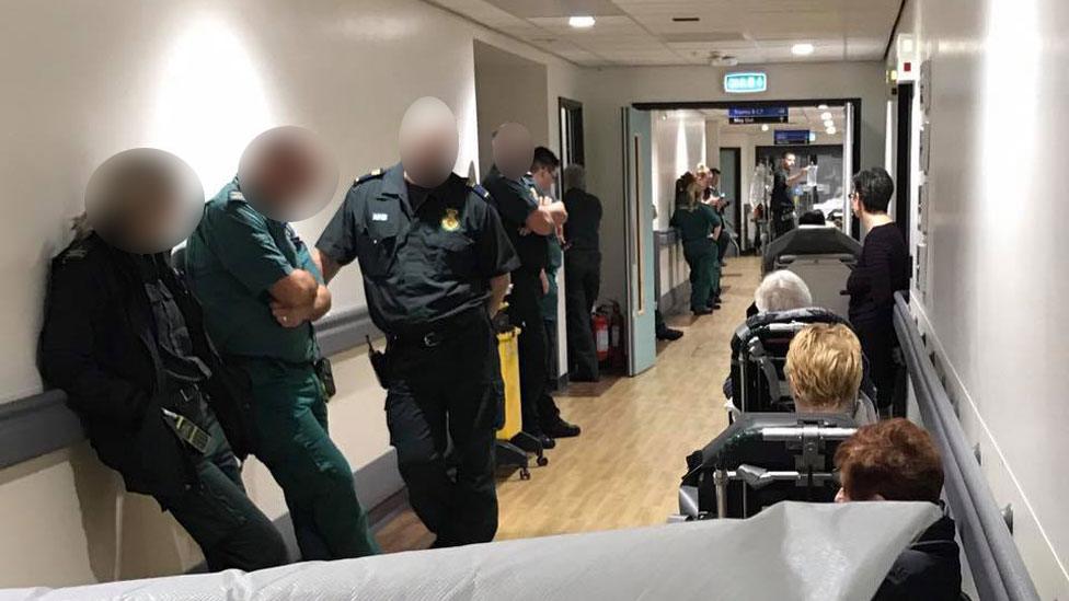 'Twenty ambulance staff' queue for hours in A&E corridor - BBC News
