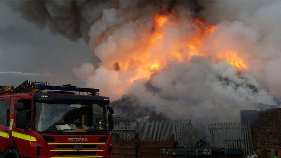 Fire crews continue to tackle blaze at Seaforth docks - BBC News