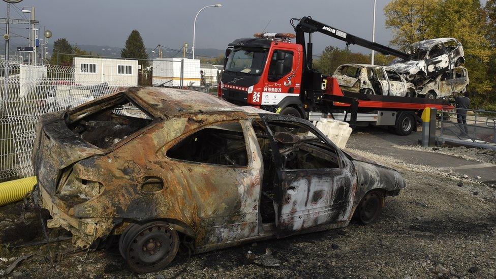 France PM Valls promises crackdown after cars burned in riot - BBC News