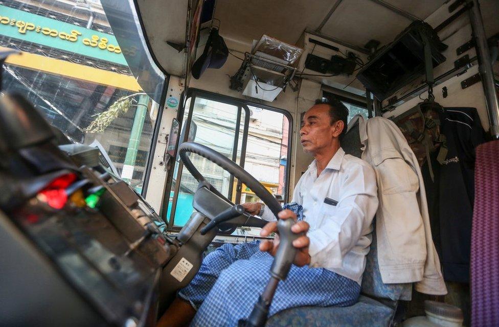 In pictures: A day riding on Yangon's new bus system - BBC News