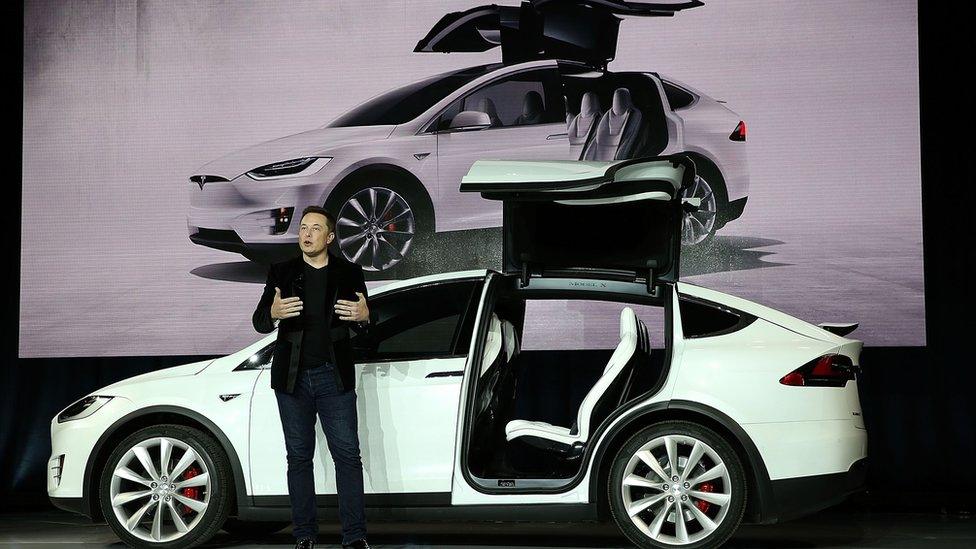 Electric carmaker Tesla announces new model as sales rise - BBC News