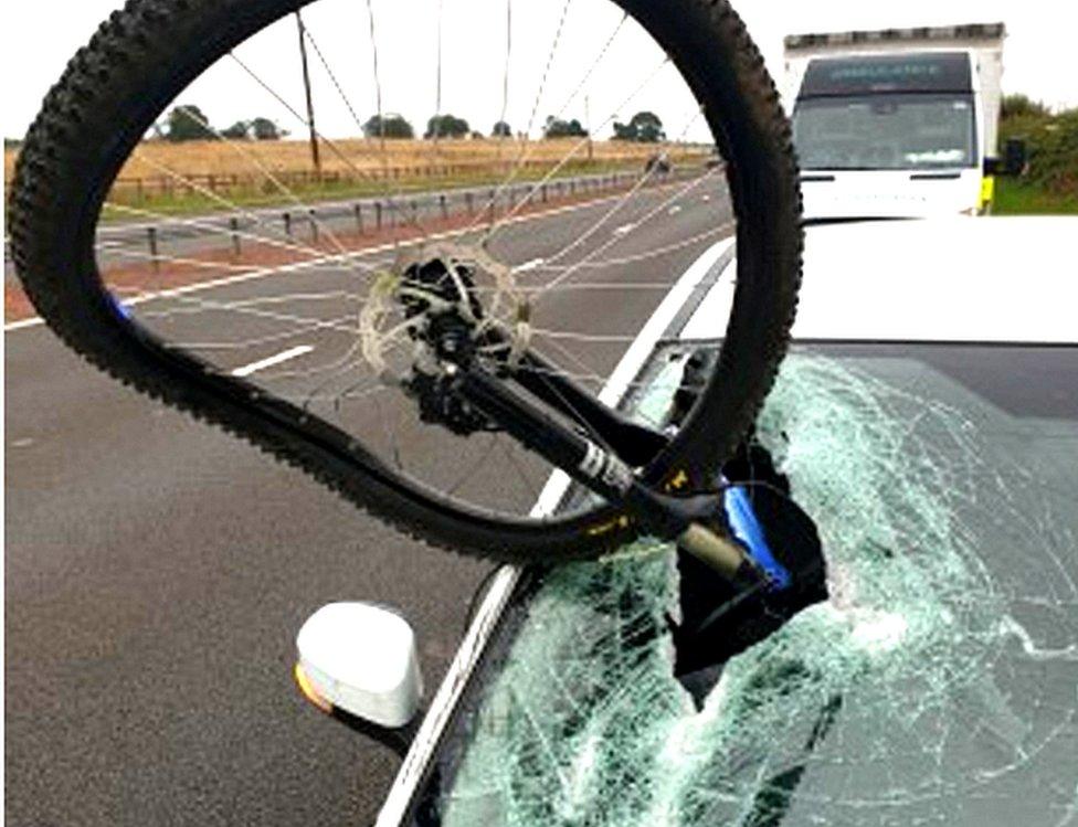 Bike crashes through driver's windscreen on M9 at West Lothian - BBC News