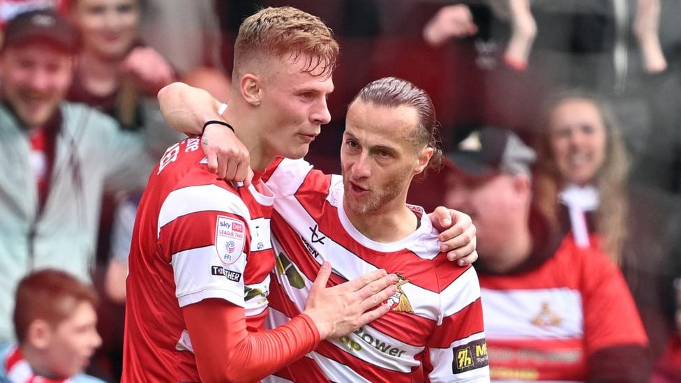 Doncaster Rovers fans and players celebrate at stadium event - BBC News