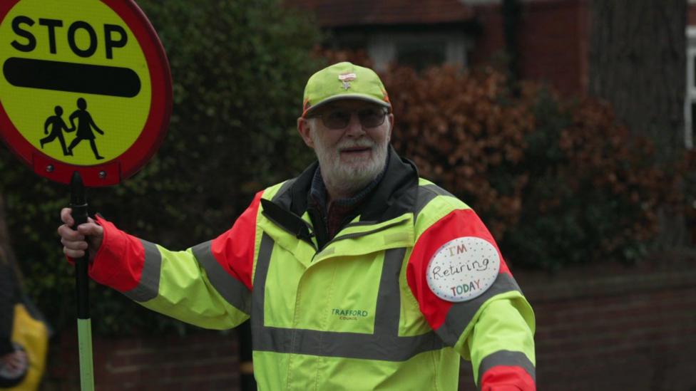 Sale's 'legendary' lollipop man hangs up stop sign after 23 years - BBC ...