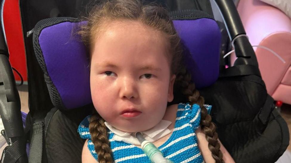 Warton girl with facial paralysis 'smiles during swim' with mum - BBC News