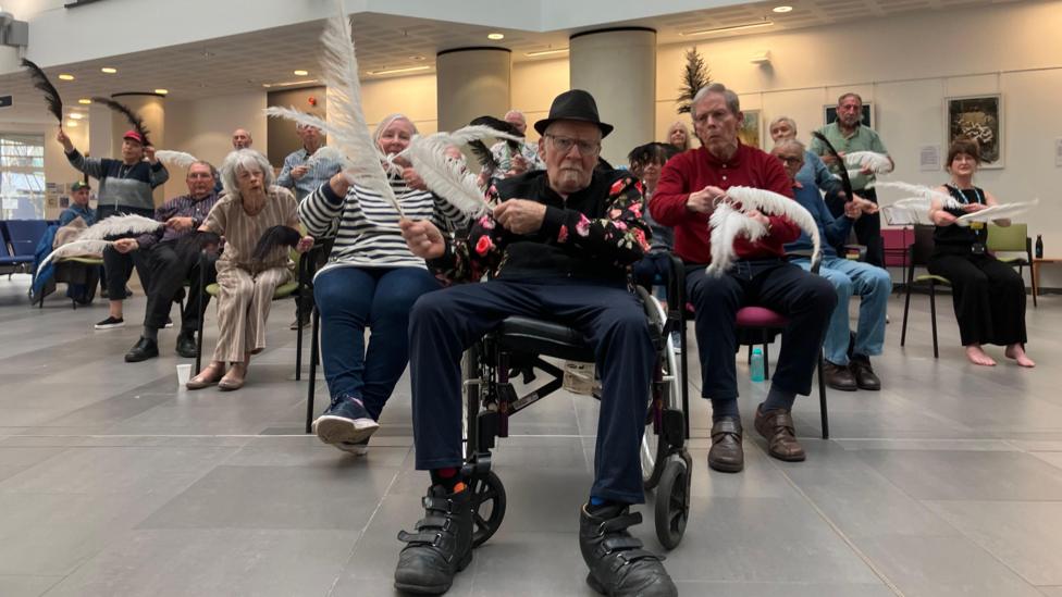 Woman says dancing with Parkinson's group 'gives new spark' - BBC News