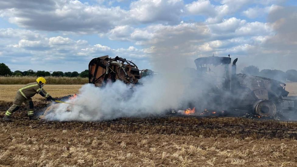 Tuttington field fire destroys tractor, baler and straw crop - BBC News
