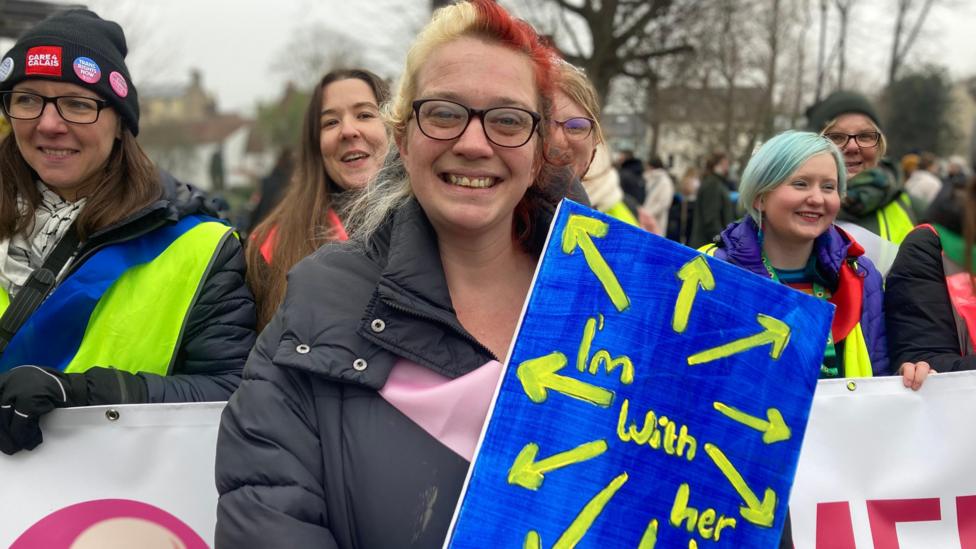 Hundreds join women's march through Cambridge city centre - BBC News