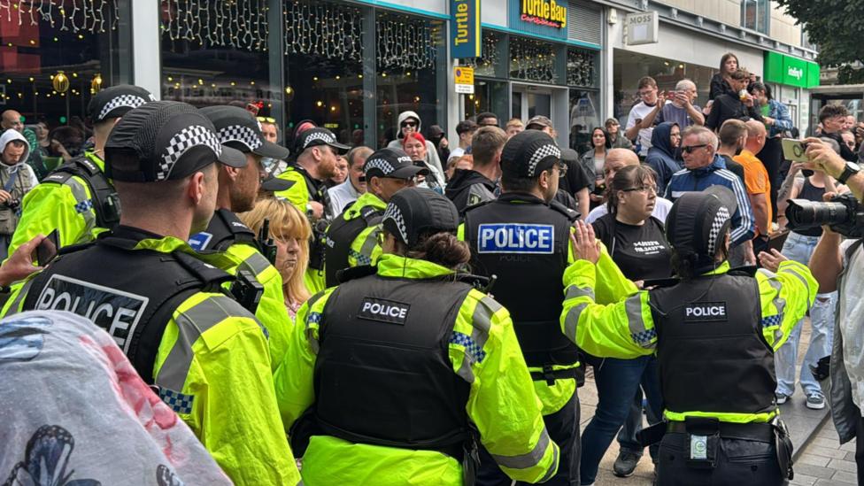 Chairs and bottles thrown as protesters clash in Blackpool - BBC News