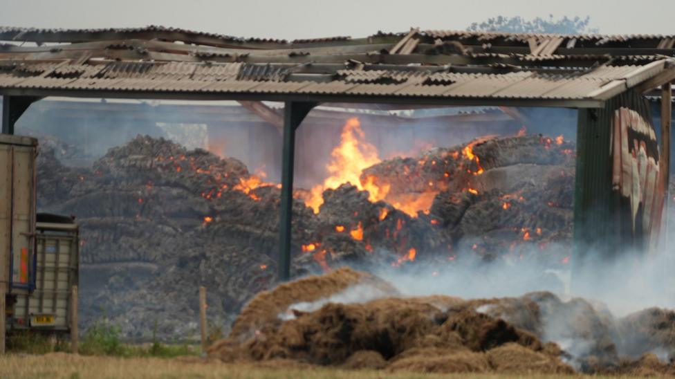 Claverham residents return to houses after barn fire controlled - BBC News
