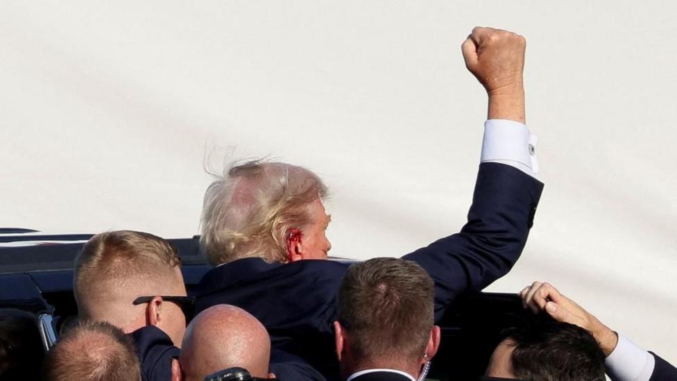 American politics enters dark new chapter after Trump shooting - BBC News