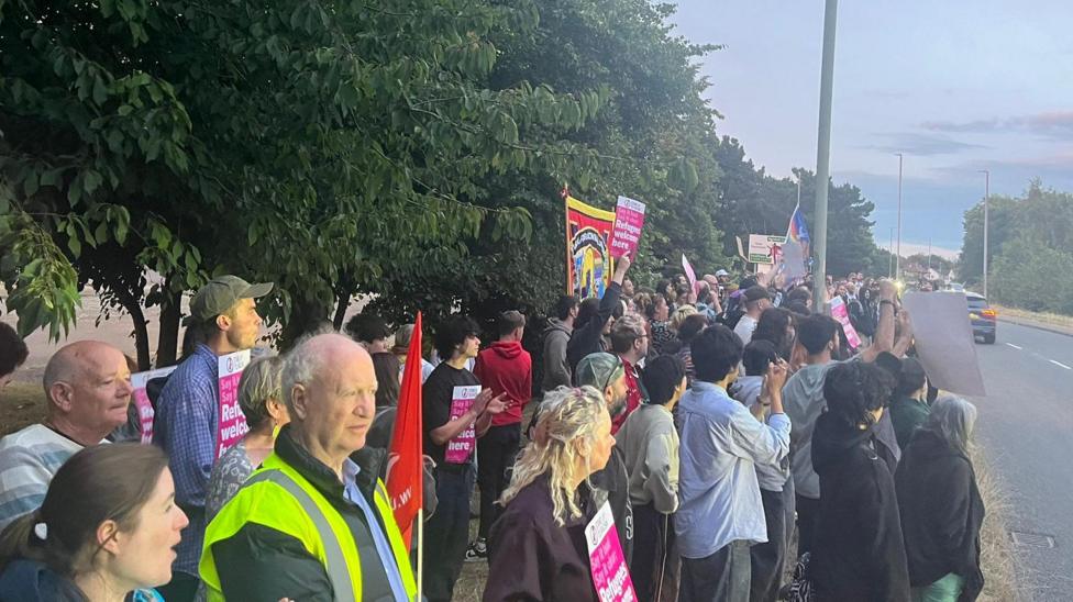 Norwich anti-racism protest after claims hotel "at risk" - BBC News