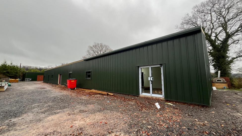 Much Wenlock farm shop destroyed by fire will reopen, owners say - BBC News