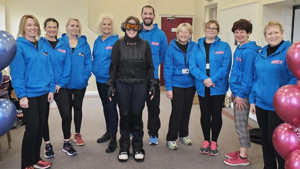 Age simulation suits help Derbyshire charity staff 'understand' - BBC News