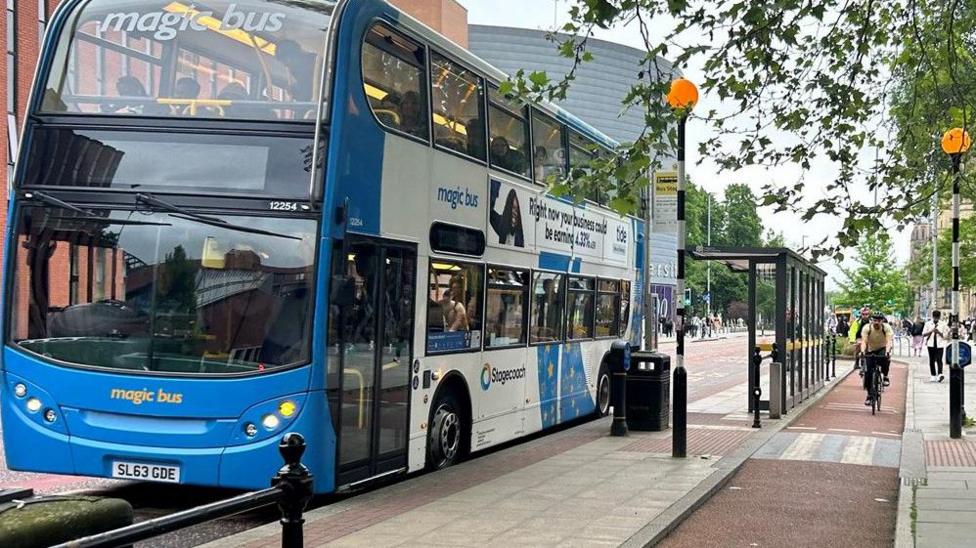 Manchester: Call for an end to cycle lanes behind bus stops - BBC News
