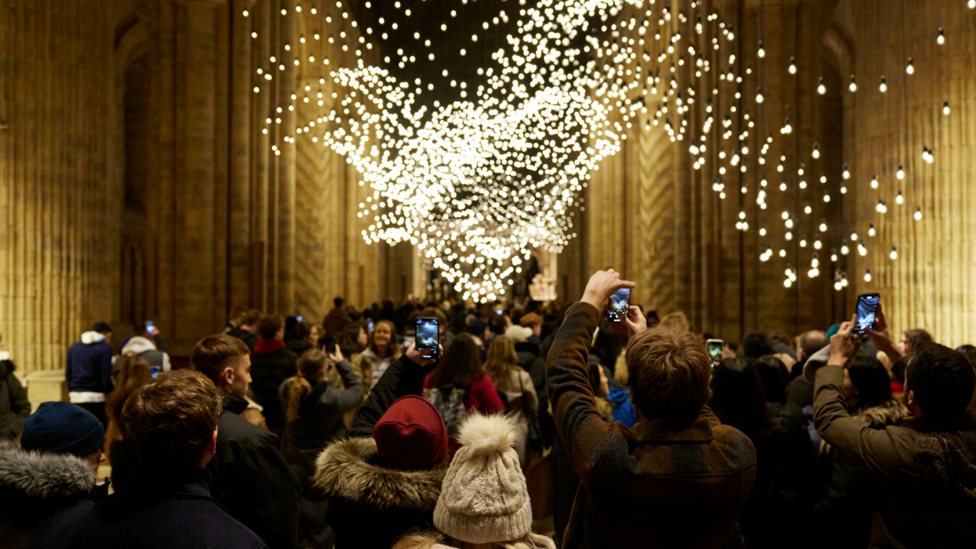 Durham's Lumiere over the years in nine glowing pictures - BBC News