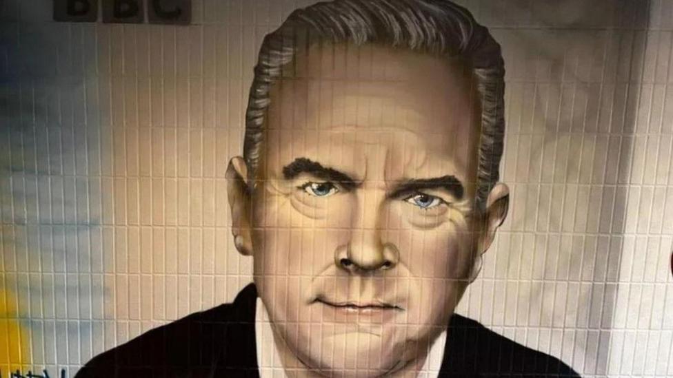 Huw Edwards hometown mural painted over by artist - BBC News