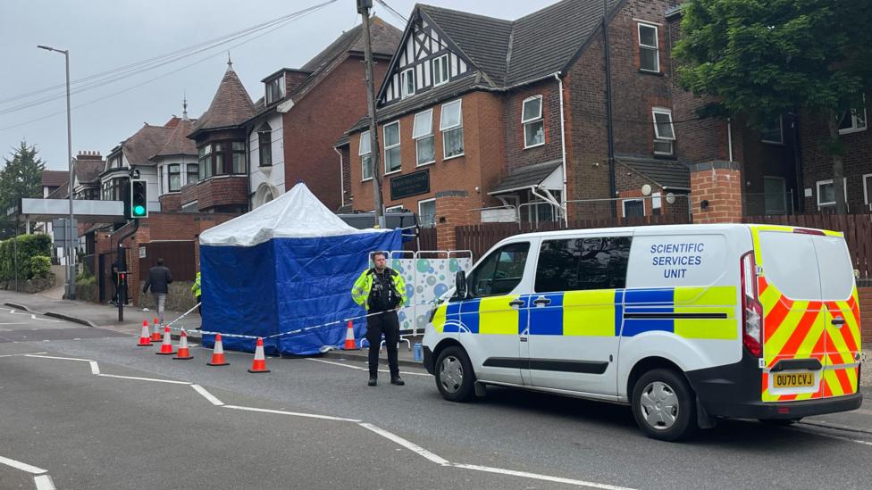 Woman 'stable' after being stabbed near Luton school - BBC News