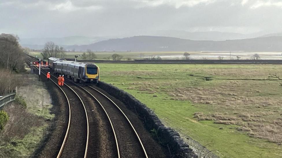 Hole found under track where train derailed at Grange-over-Sands - BBC News