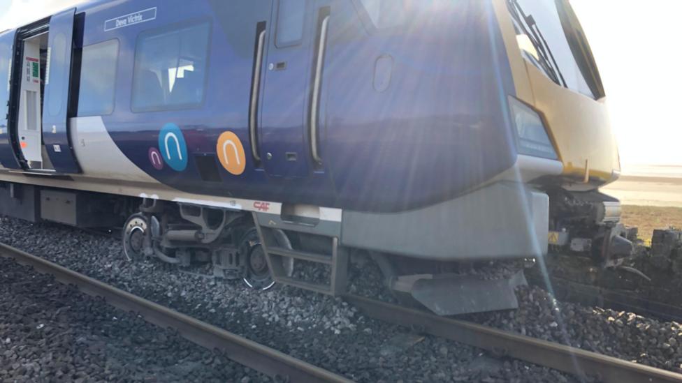 Derailed Cumbria train repairs to cause two weeks of delays - BBC News