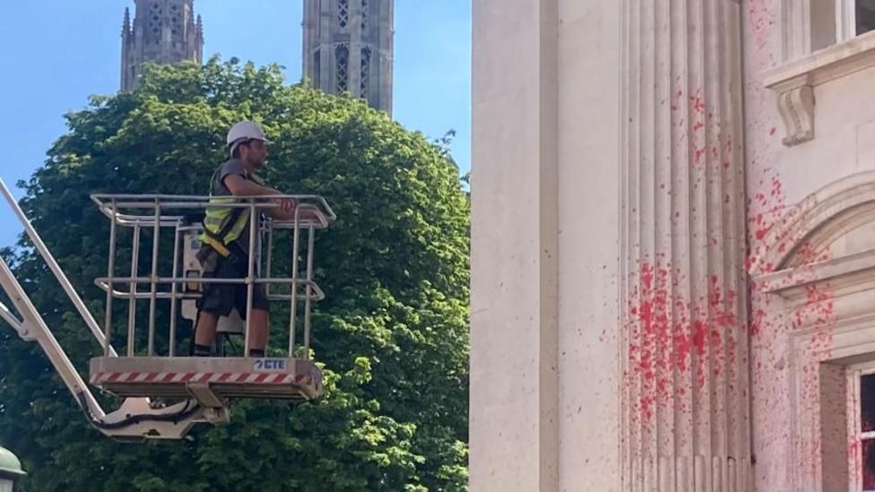 University of Cambridge building cleaned after protesters spray paint ...