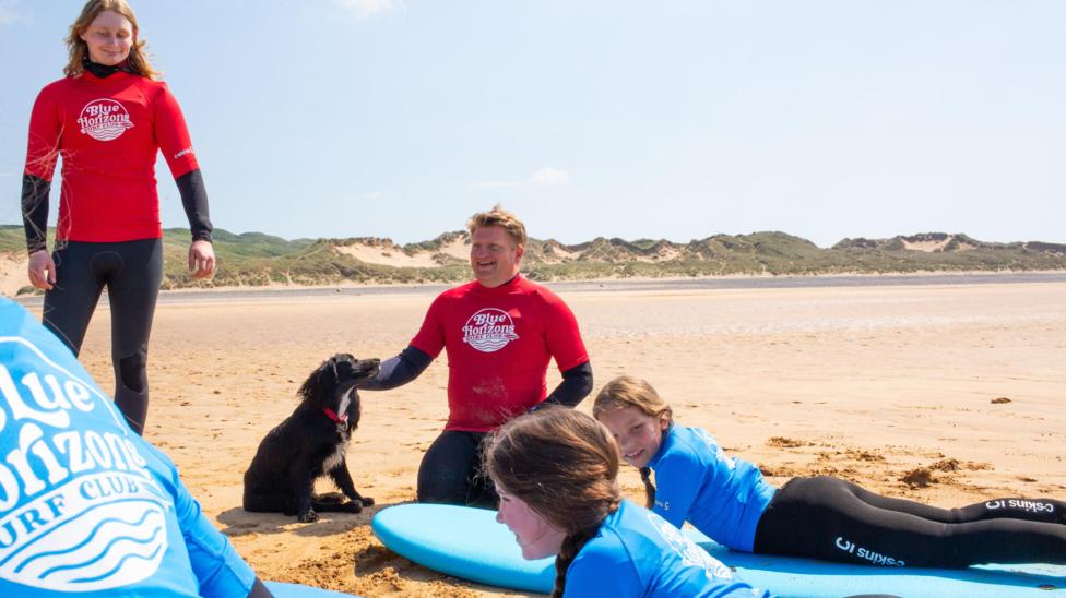 Six-legged 'mermaid' dog Ariel finds new home by the sea in Wales - BBC ...