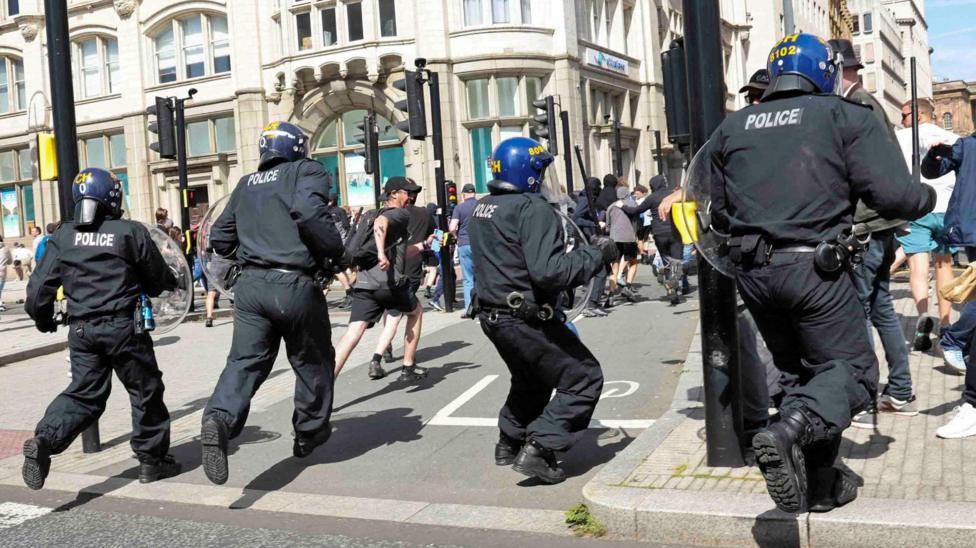 Three charged with violent disorder over Liverpool unrest - BBC News