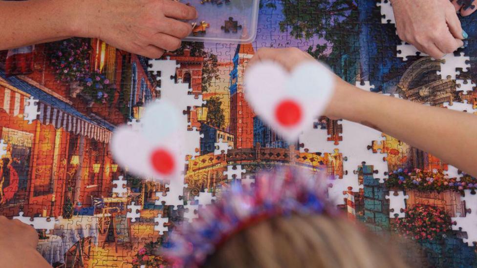 World Jigsaw Puzzle Championships 2024 in pictures - BBC Newsround