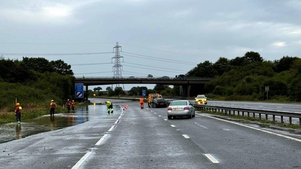 M5 Motorway lanes closed due to flooding after heavy rain - BBC News