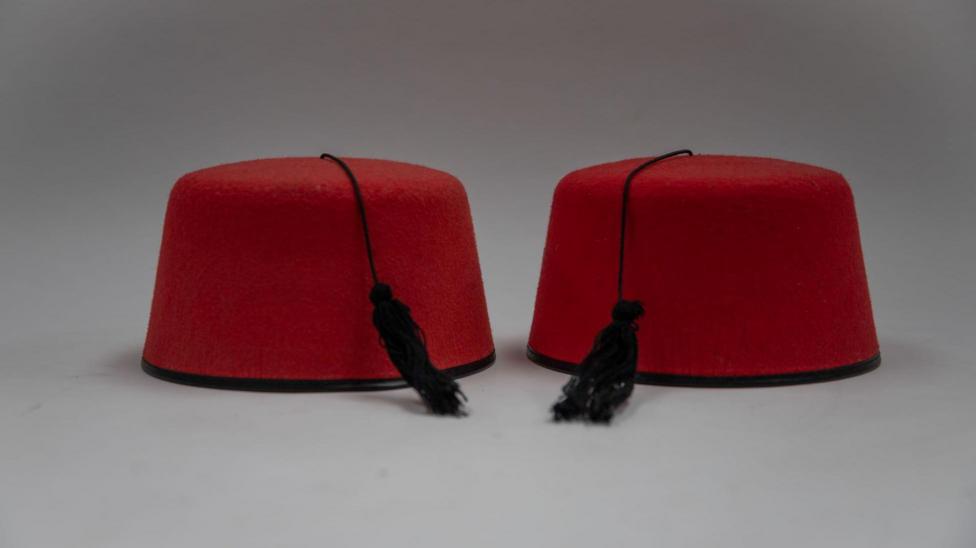Tommy Cooper's fezzes for sale at auction - BBC News