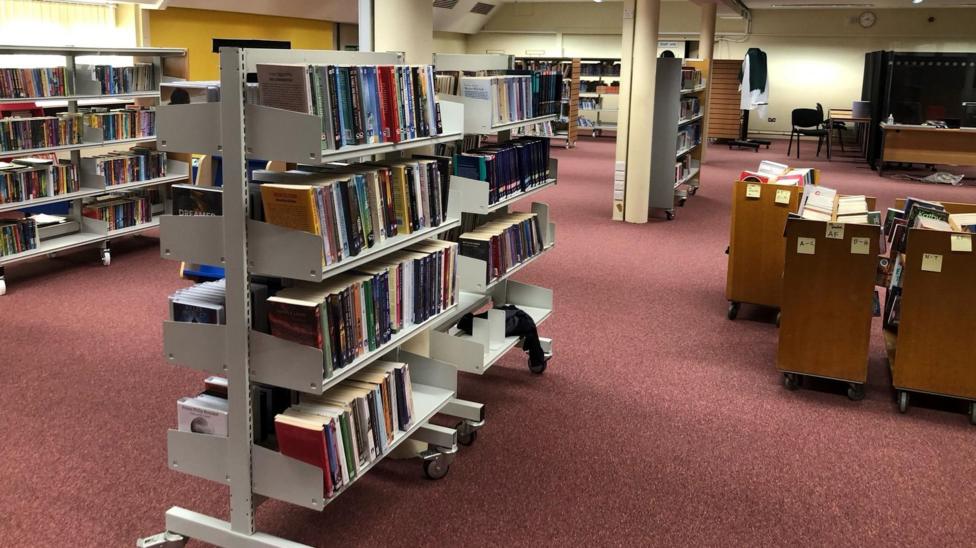 Swindon library reopens months after severe floods - BBC News