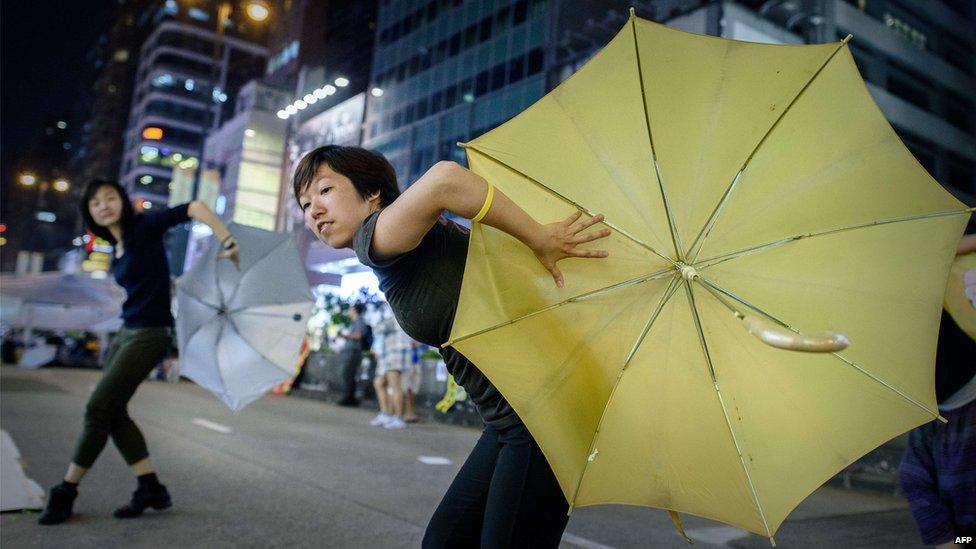Thousands mark one month of Hong Kong protests - BBC News