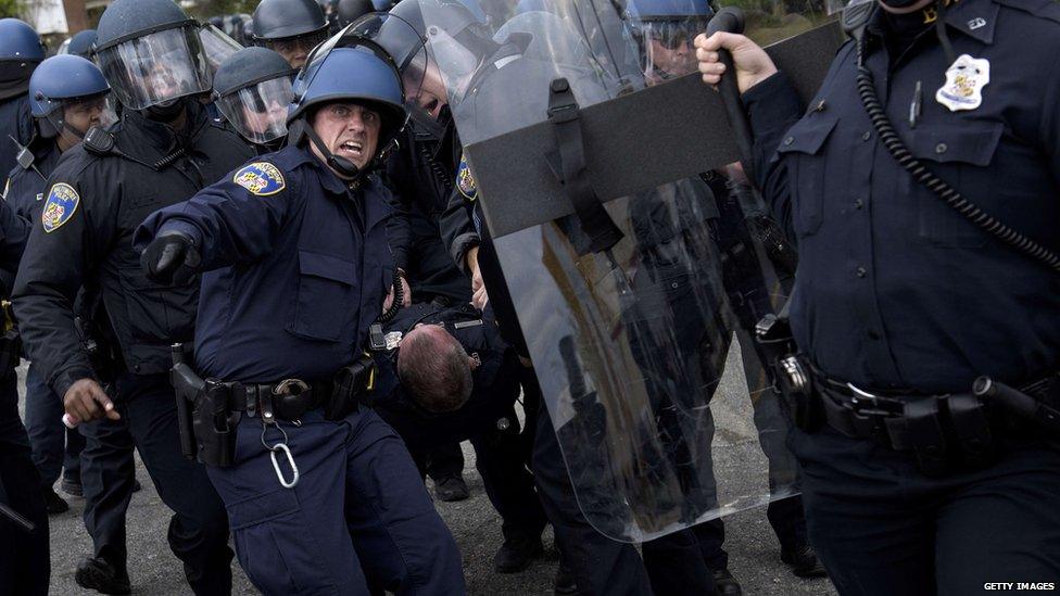 Baltimore: A night of rioting in pictures - BBC News