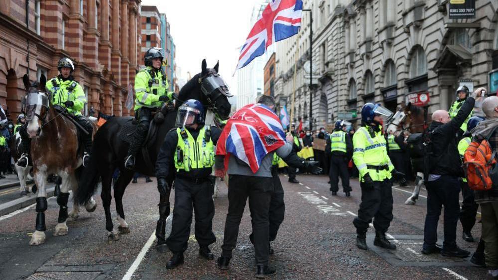 Manchester arrests as Britain First march and counter protests held ...
