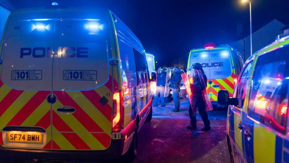 Police condemn 'violent disorder' at anti-paedophile protest - BBC News